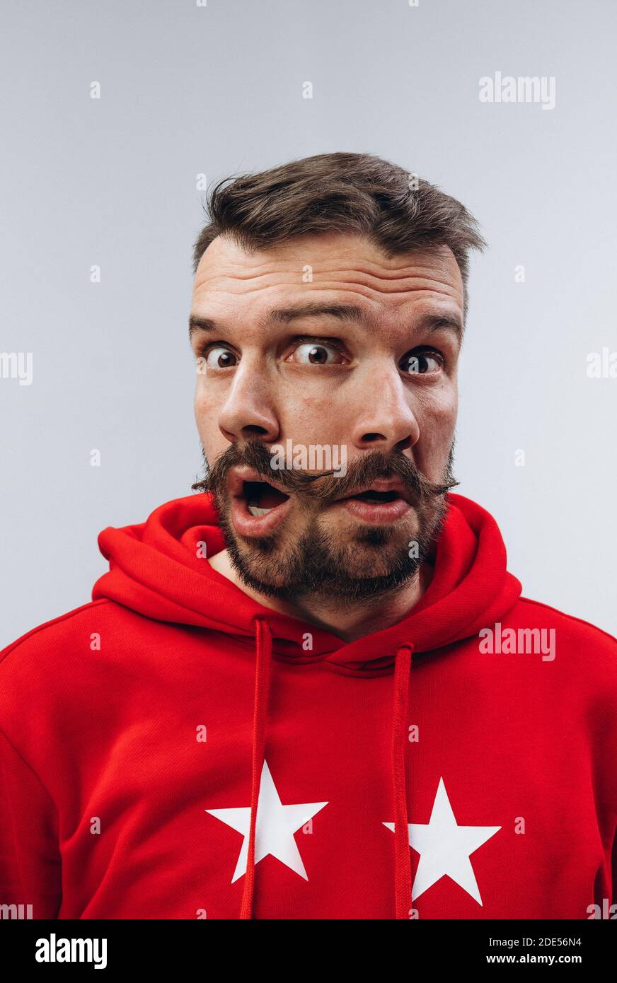 Shocked, amazed. Young man with dual emotions combination on face ...