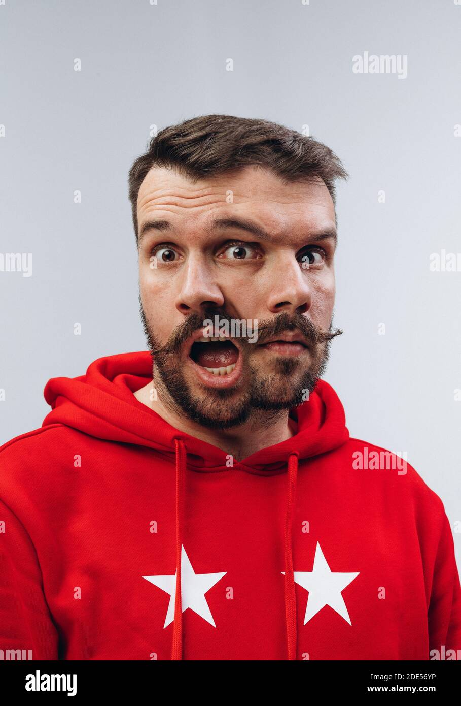 Shocked, amazed. Young man with dual emotions combination on face ...