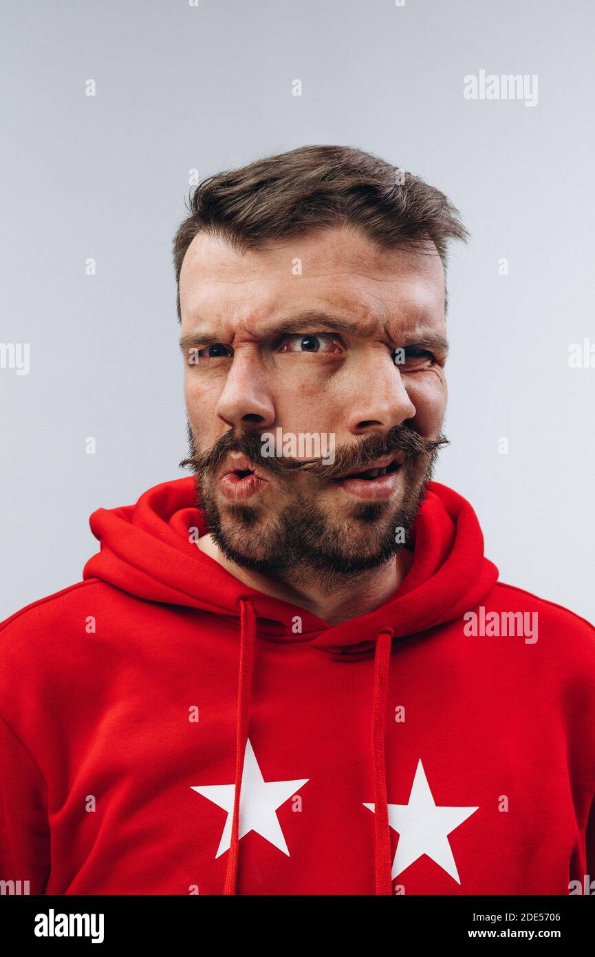 Asking, wondered. Young man with dual emotions combination on face ...