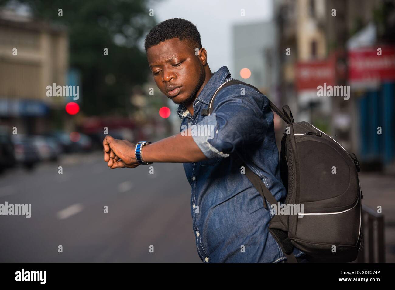African man backpack watch hi-res stock photography and images - Alamy