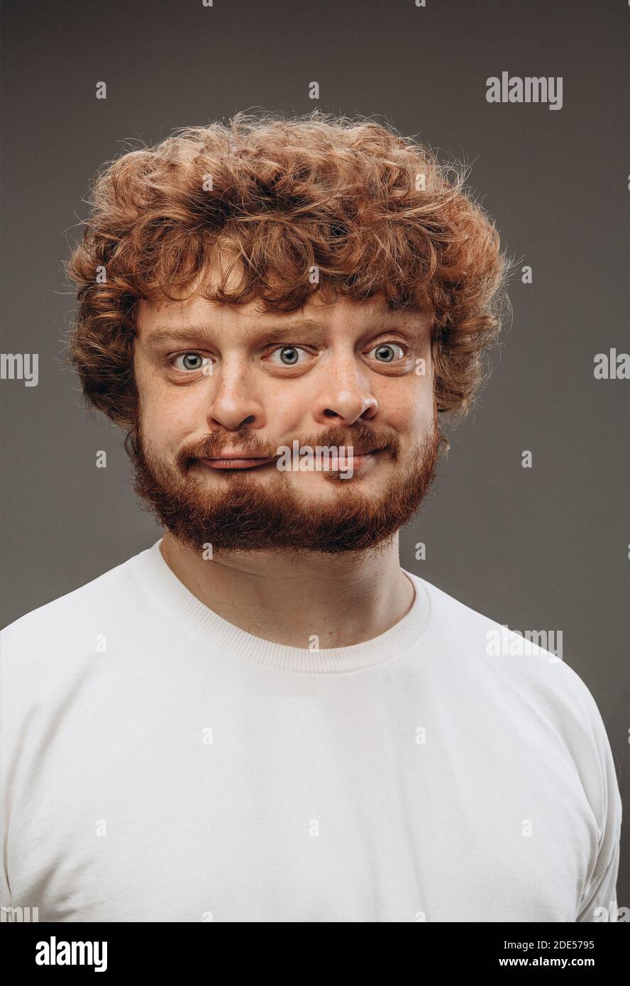 Cute, thoughtful. Young man with dual emotions combination on face ...