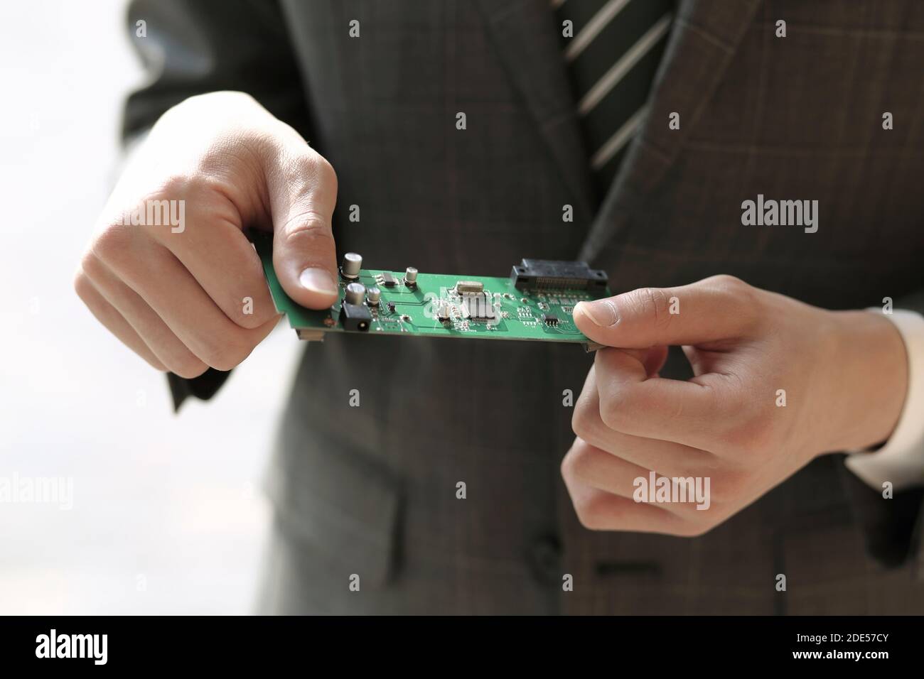Close up of businessman holding main board Stock Photo - Alamy