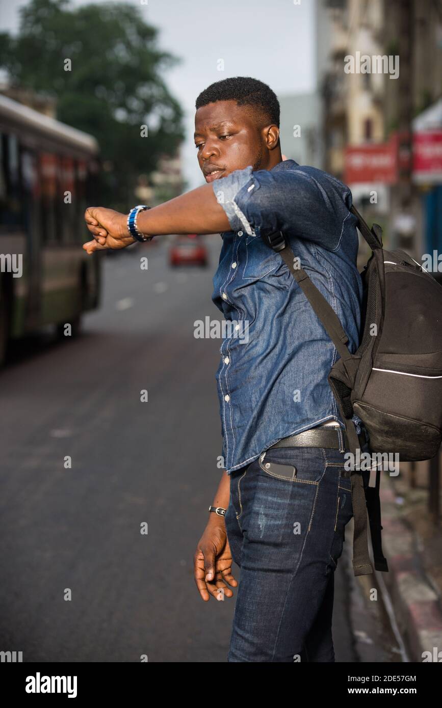 African man backpack watch hi-res stock photography and images - Alamy