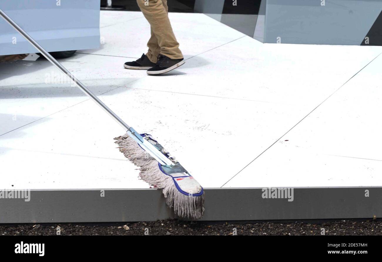 wet floor cleaning in a building with a floor mop Stock Photo - Alamy