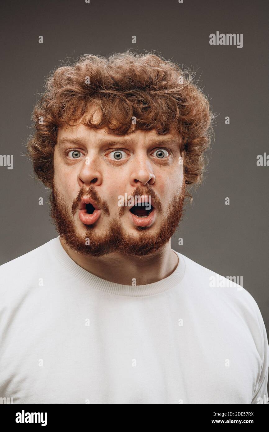 Shocked, amazed. Young man with dual emotions combination on face ...