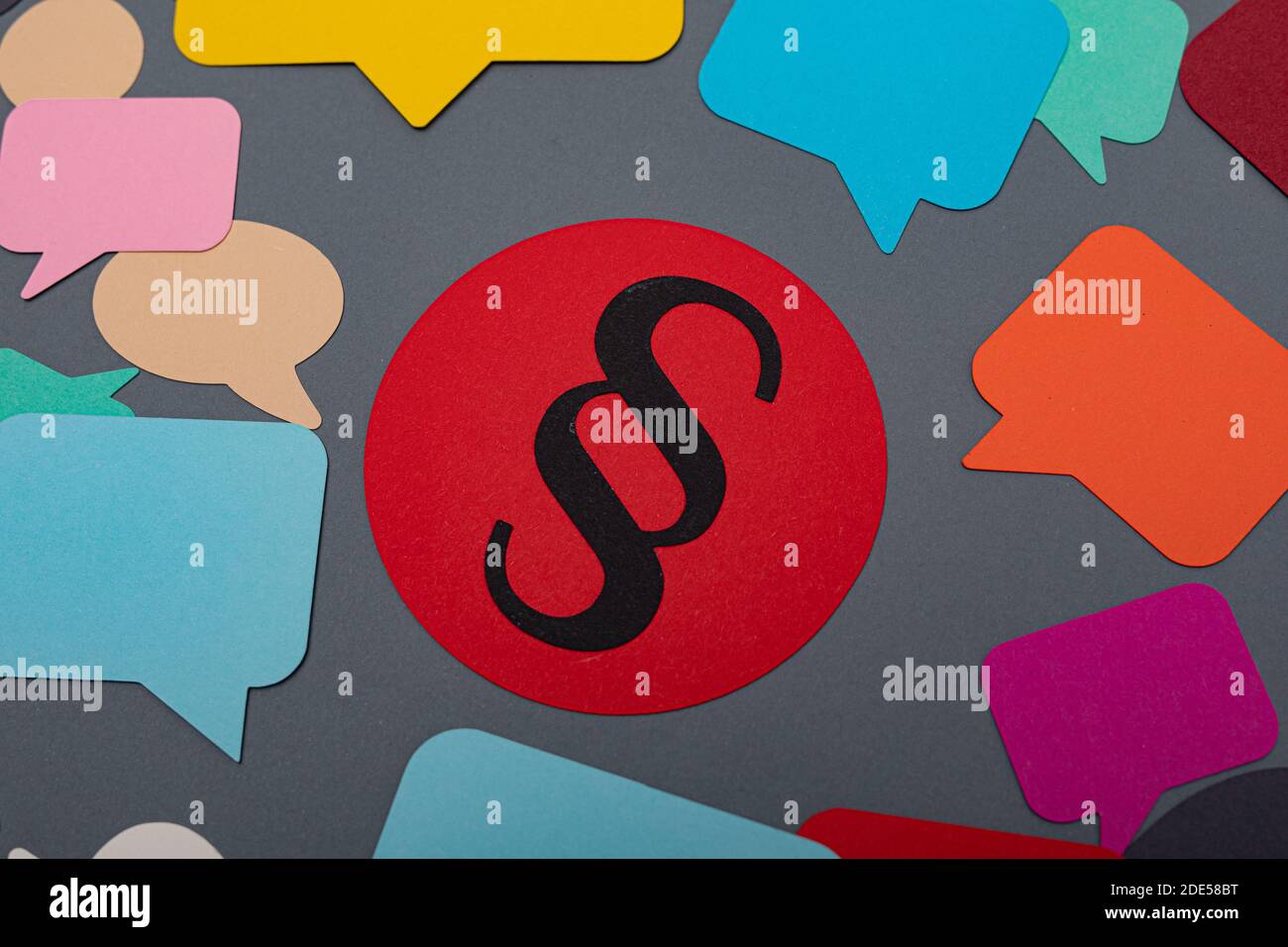 A top view shot of a red card with the law paragraph symbol Stock Photo ...