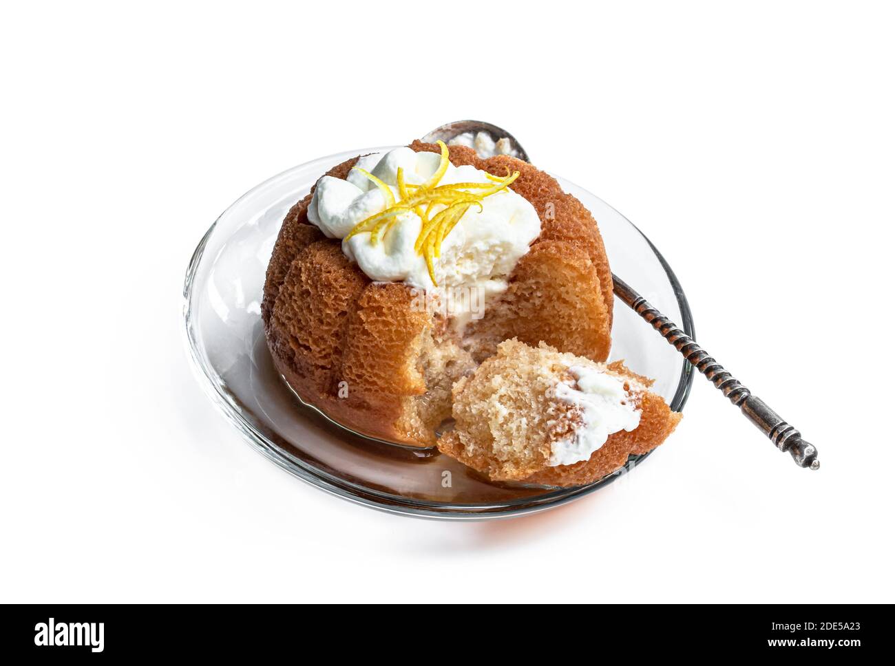 Rum baba decorated with whipped cream isolated on white Stock Photo - Alamy