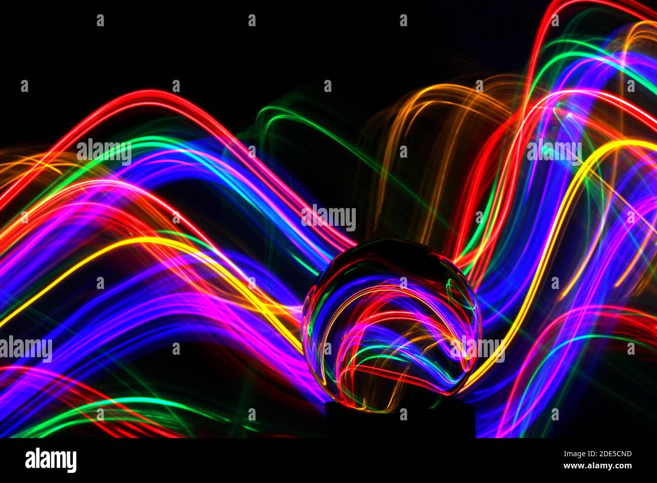 Long exposure photograph of neon multi colour in an abstract swirl ...