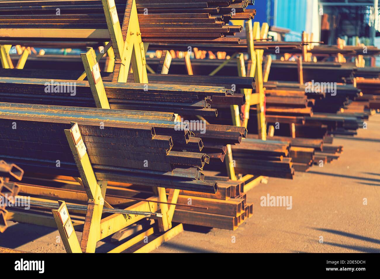 stack of steel pipe and metal beams on rack. metal pipes, profiles ...