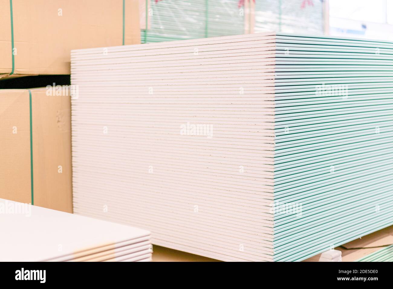Pallet with Drywall sheets plasterboard in the building warehouse store ...
