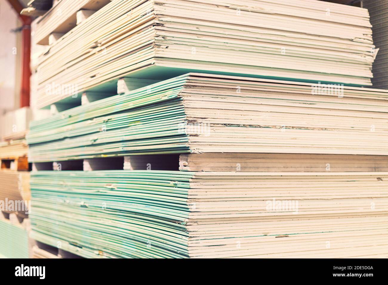 Pallet with Drywall sheets plasterboard in the building warehouse store ...