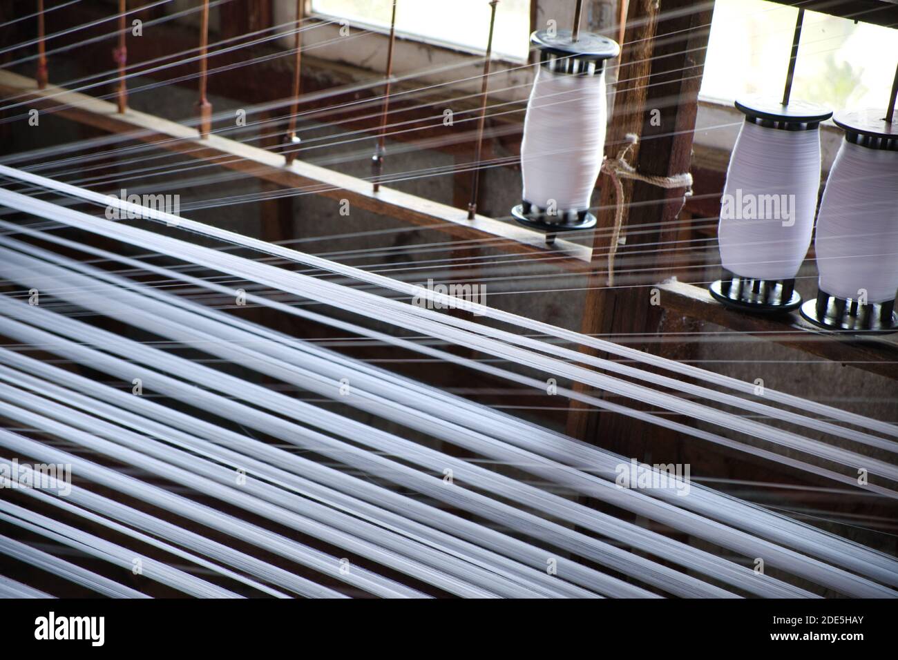 Tradition weaving loom with white cotton Stock Photo - Alamy