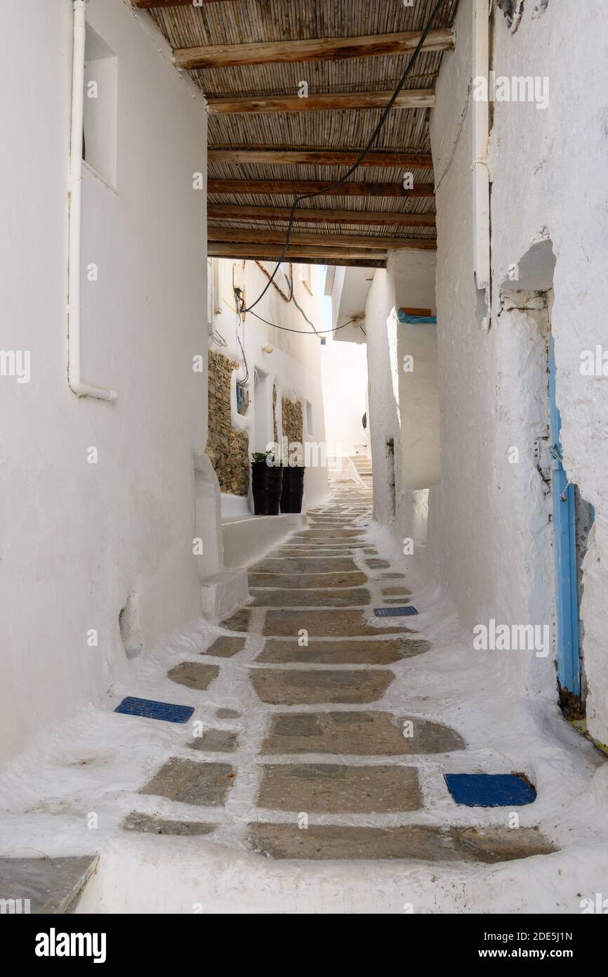 A street in the old town of Chora, the capital of Ios Island ...