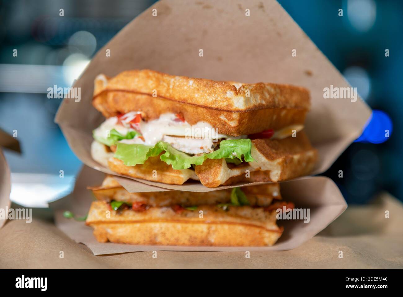Sandwich in a paper bag close-up. Sandwich filet americain, close up of ...