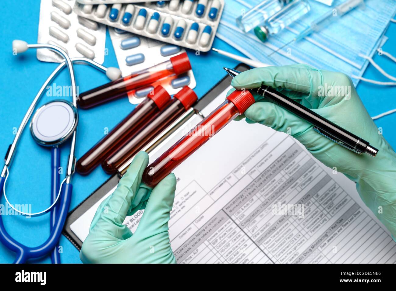 lab technician assistant or doctor wearing rubber or latex gloves ...