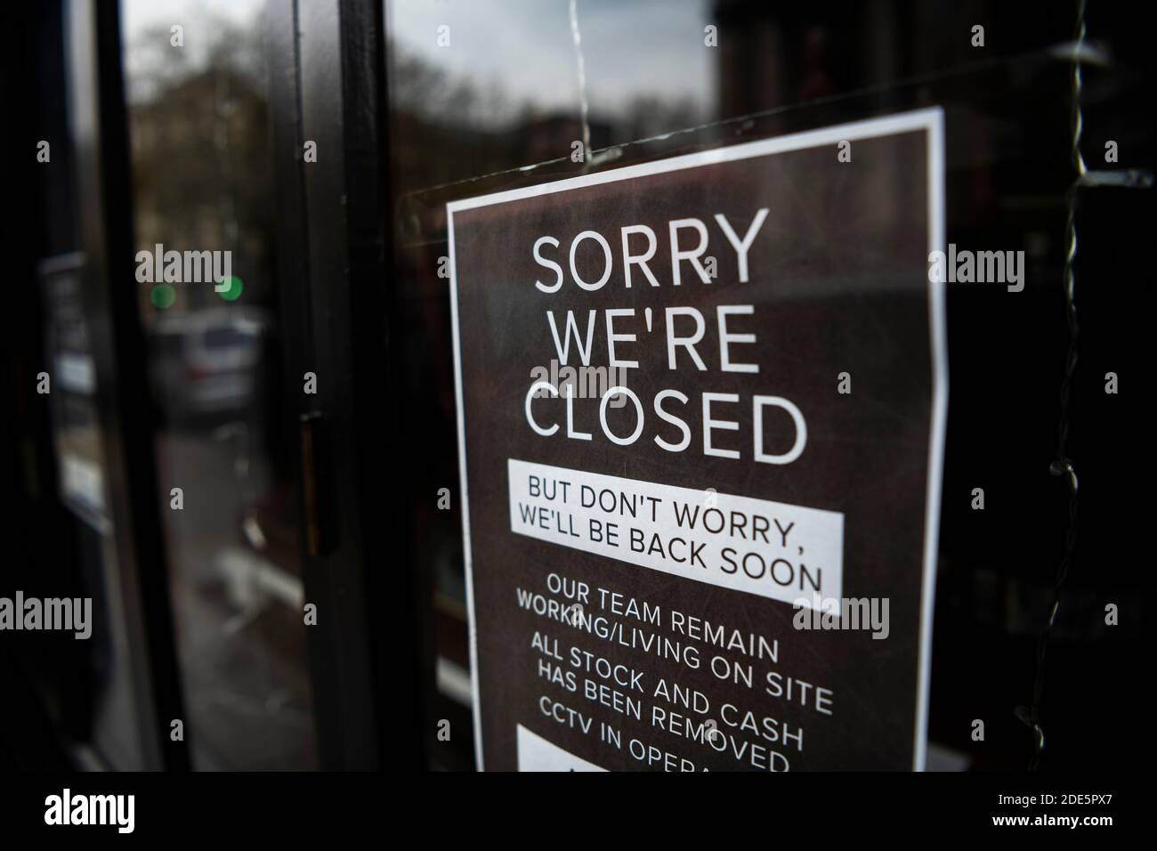 Coronavirus Covid-19 information sign in a shut shop window saying ...