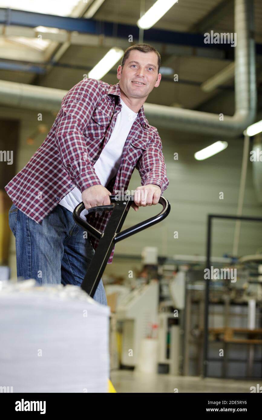 happy worker in a warehouse Stock Photo - Alamy