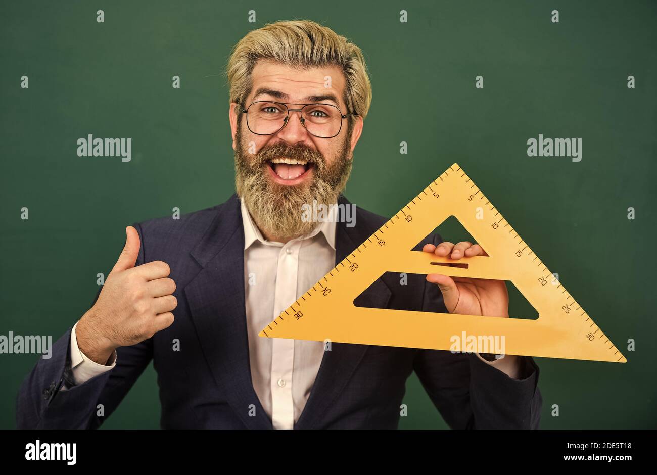 Mathematics favorite subject. Man teacher use math rule tool. Bearded ...