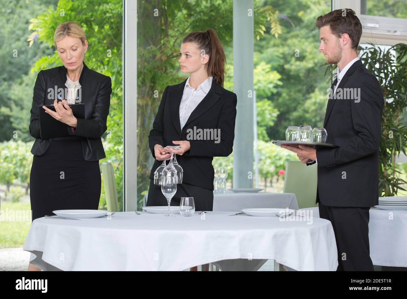 Waitress laying the table hi-res stock photography and images - Alamy