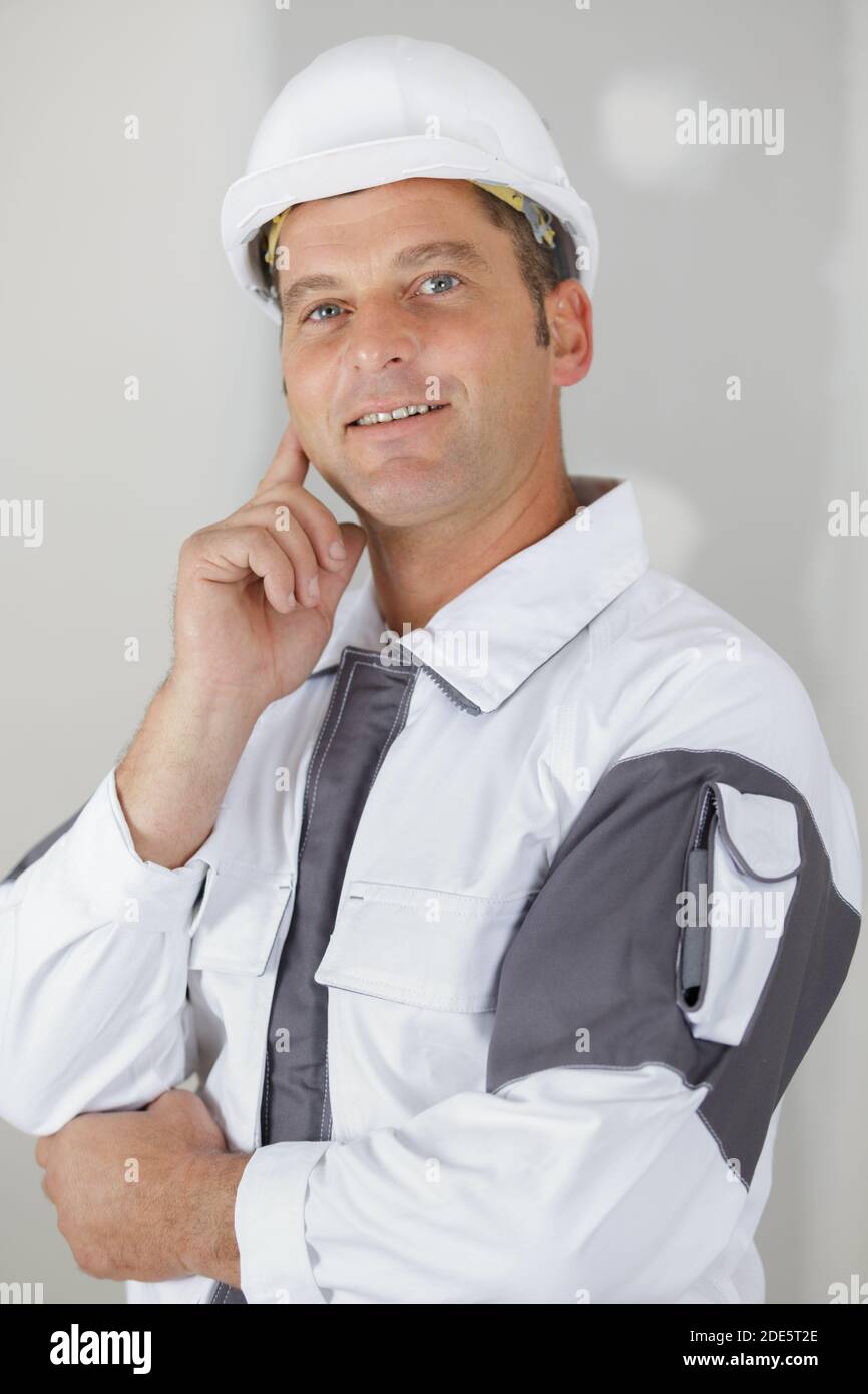 smiling builder looking at camera Stock Photo - Alamy
