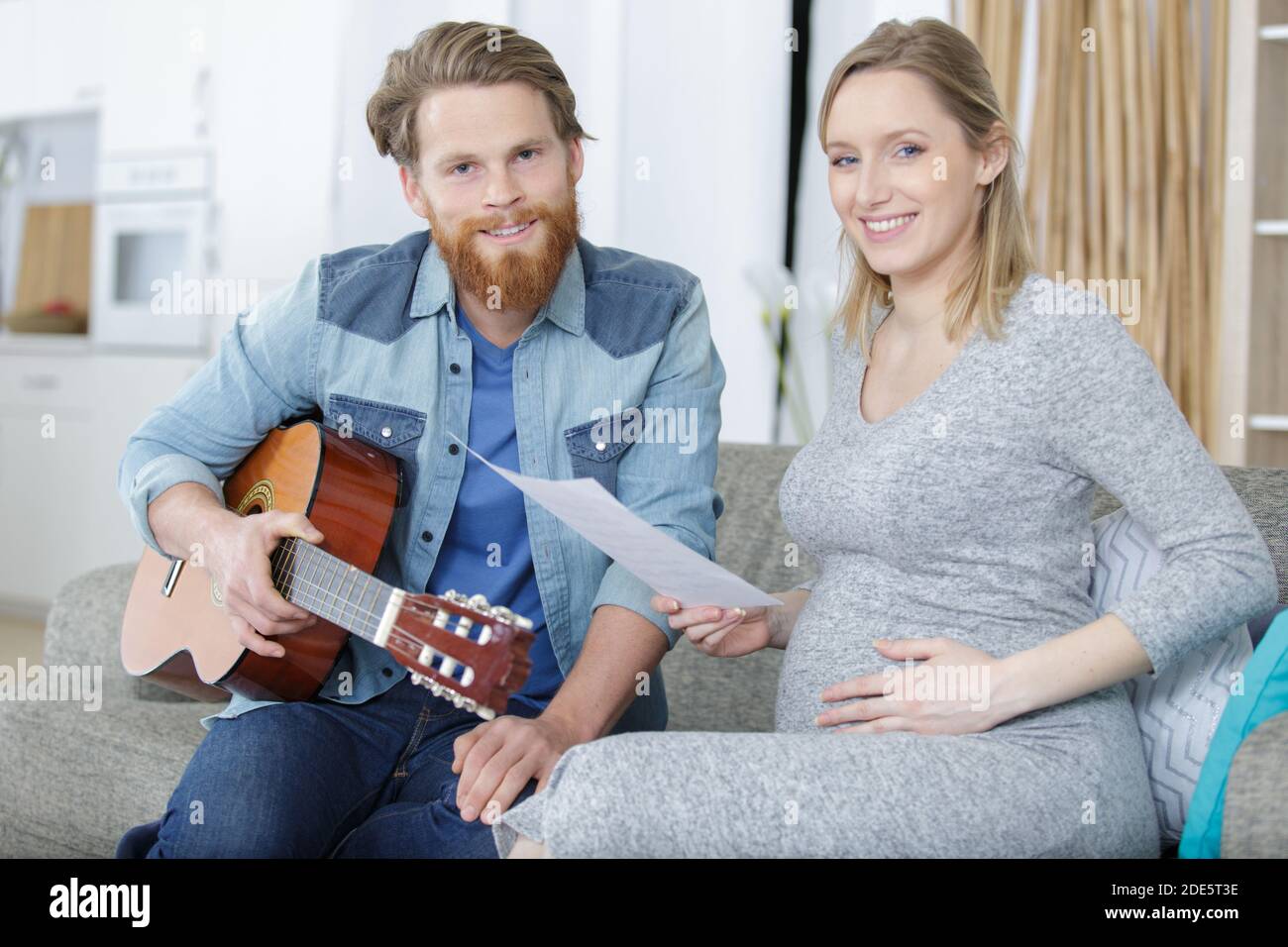 romantic husband playing music to woman Stock Photo - Alamy