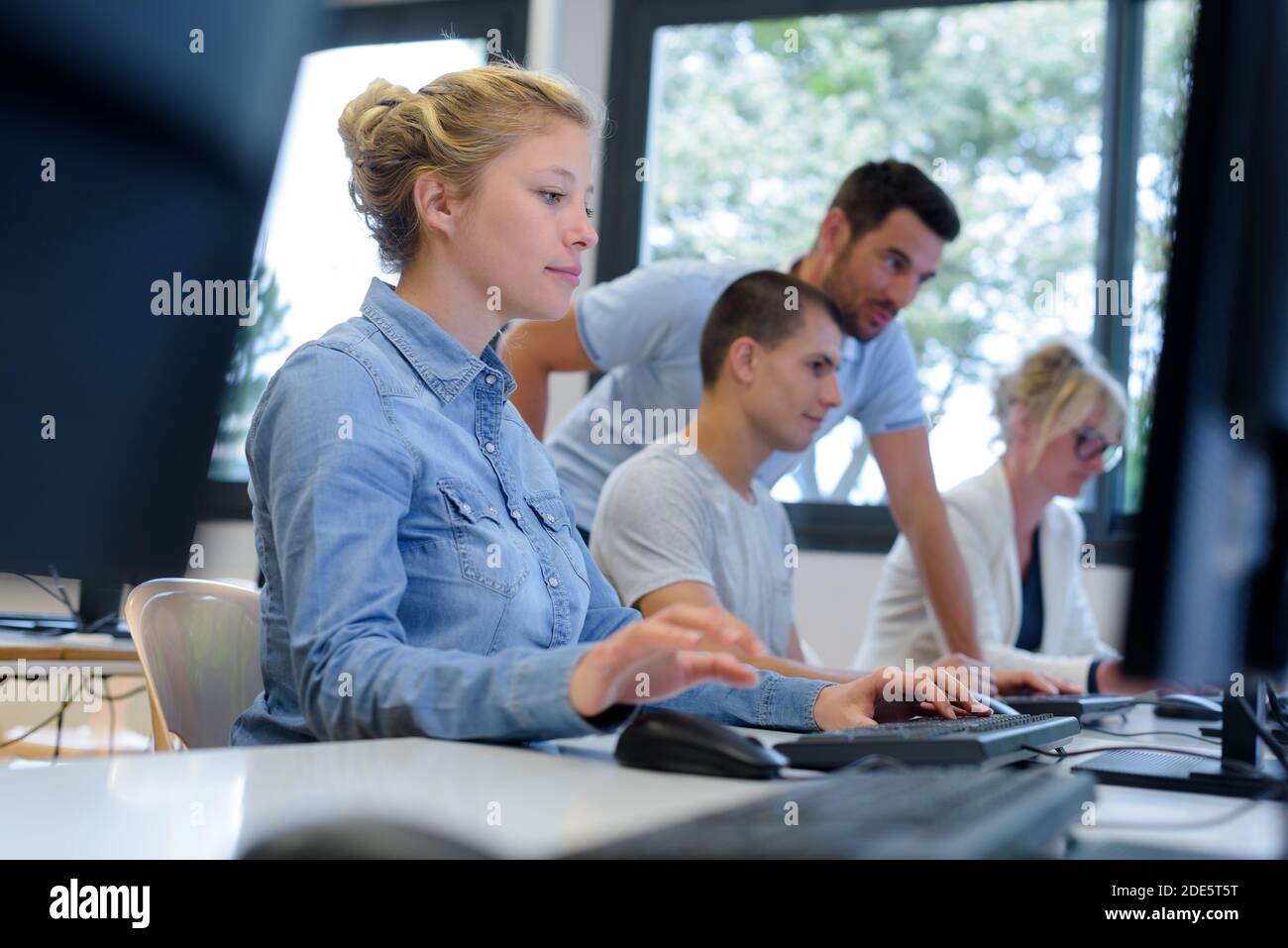 a few students at class Stock Photo - Alamy
