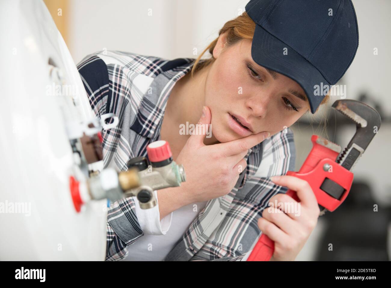 plumber woman installing pipes Stock Photo - Alamy