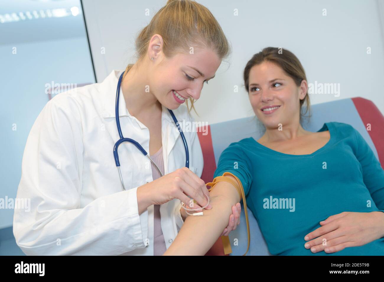 pregnant woman getting her pulse checked Stock Photo - Alamy