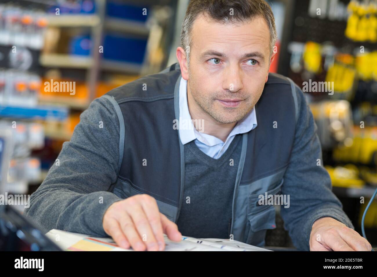workers in a store counter Stock Photo - Alamy