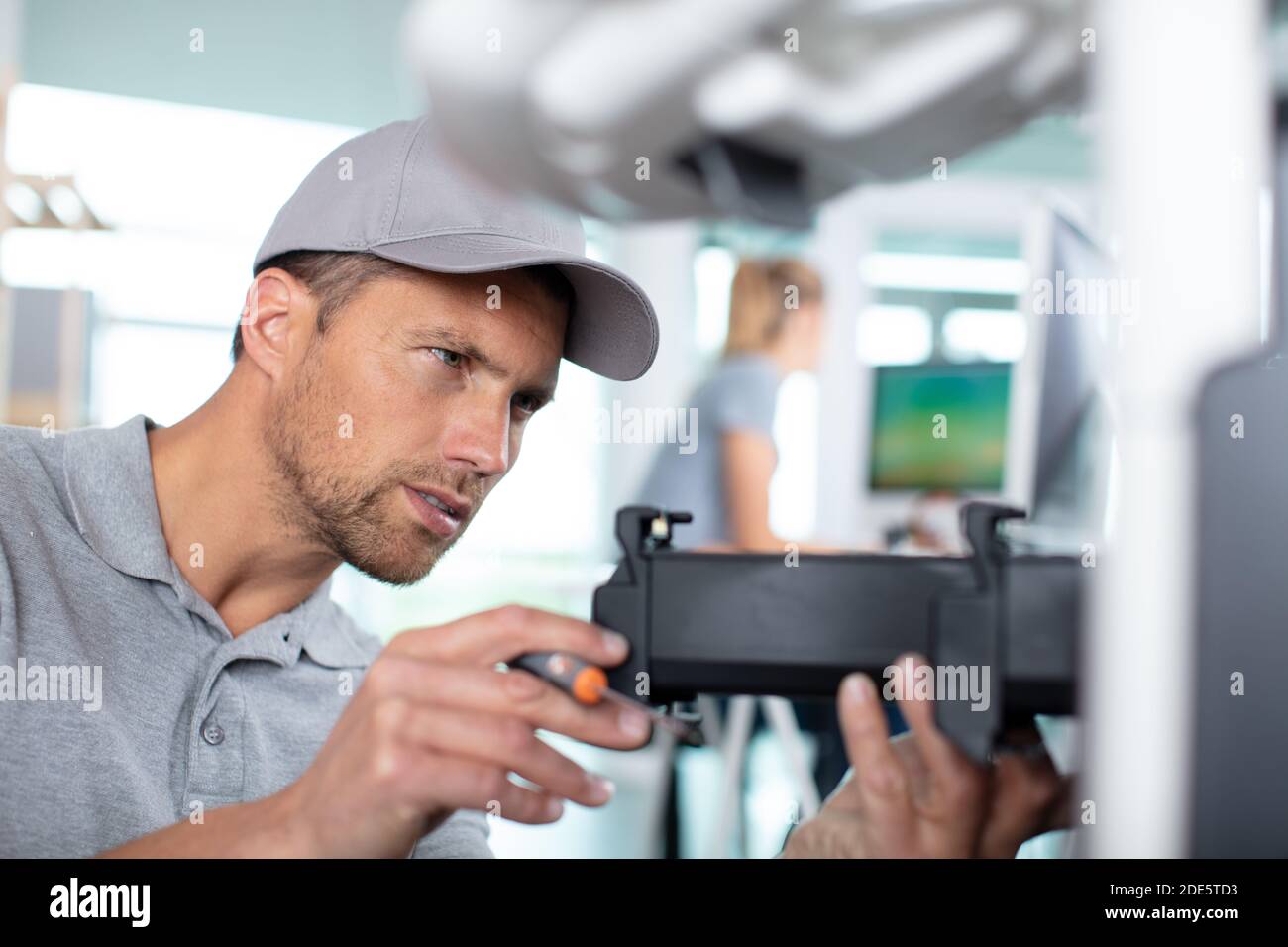 man technician repairing a printer at business place at work Stock ...