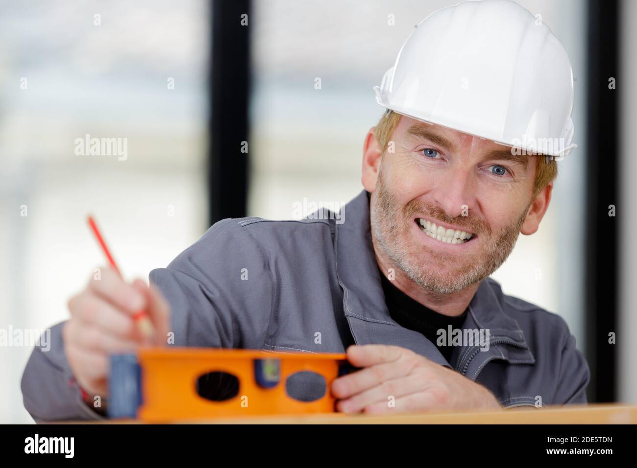 happy smiling contractor looking at camera Stock Photo - Alamy