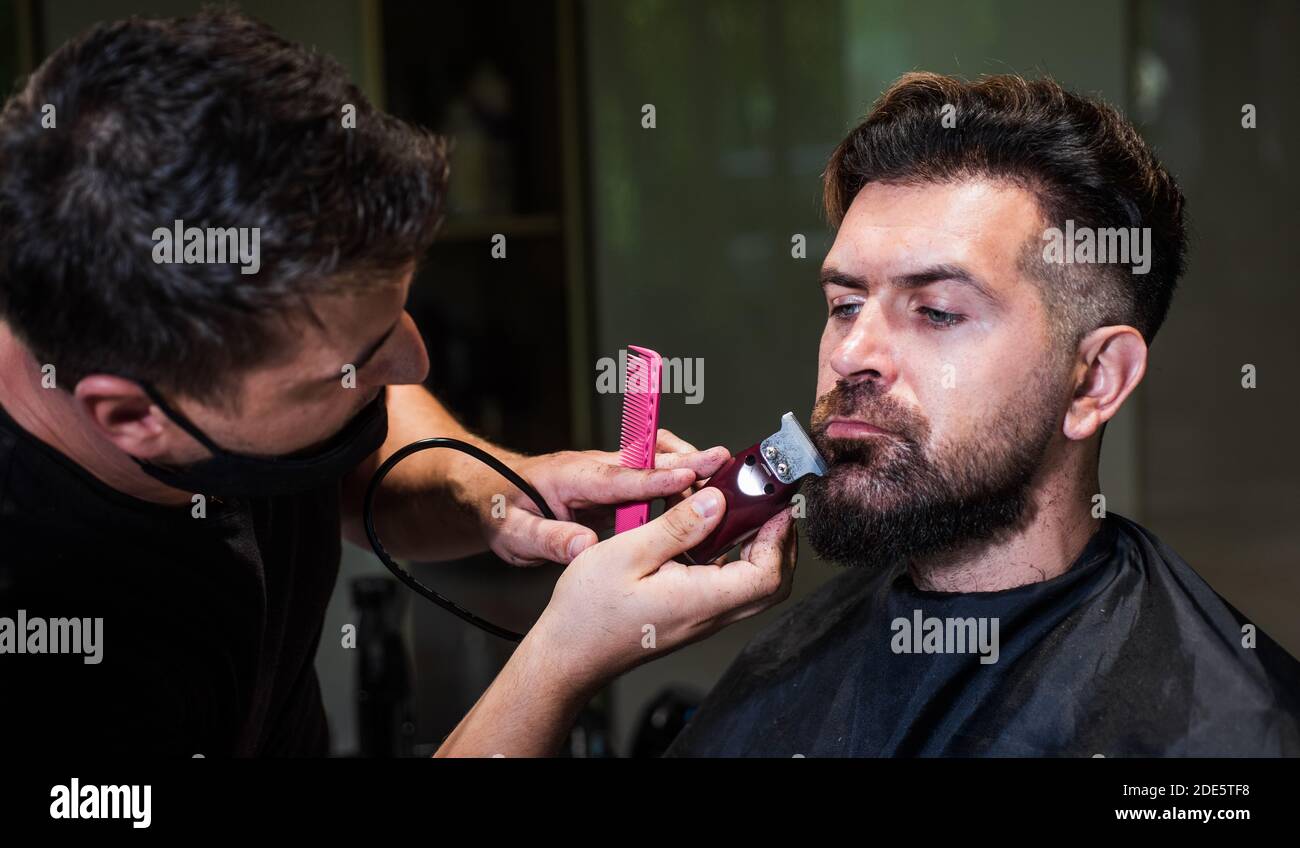 Grooming of real man. mature hipster with beard at hairdresser. brutal ...
