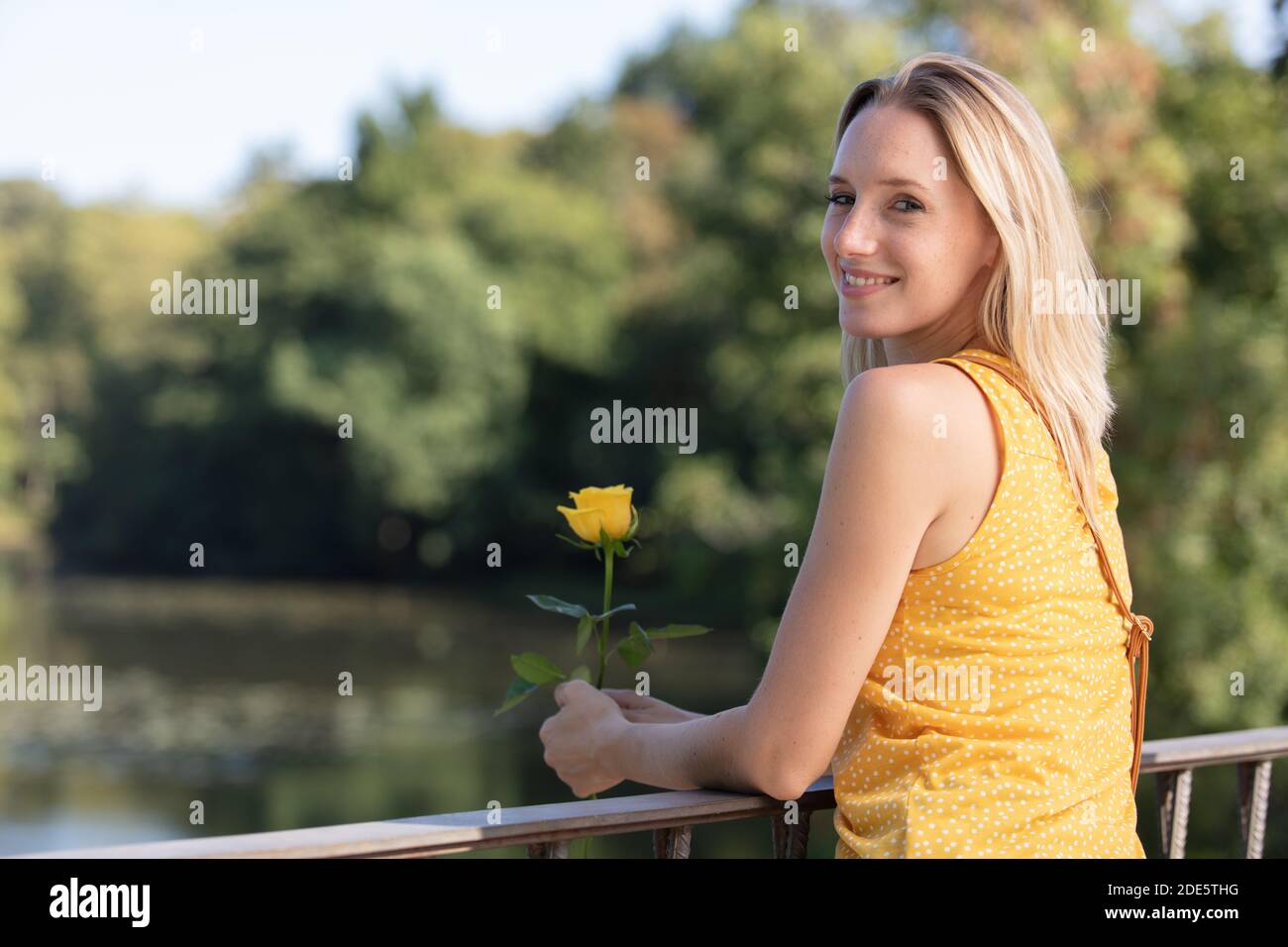 Woman standing bridge overlooking river hi-res stock photography and ...