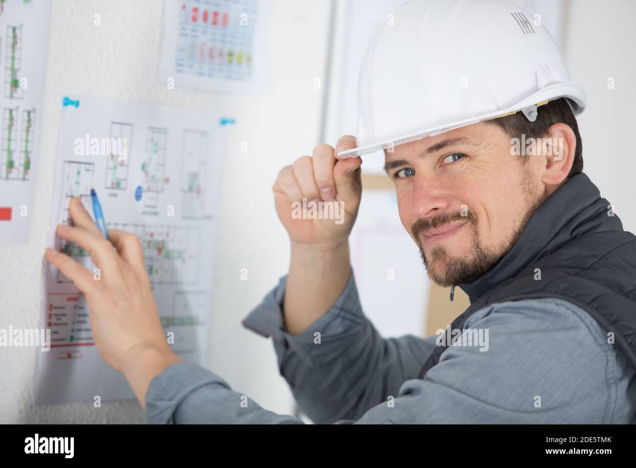 Examining draft map hi-res stock photography and images - Alamy