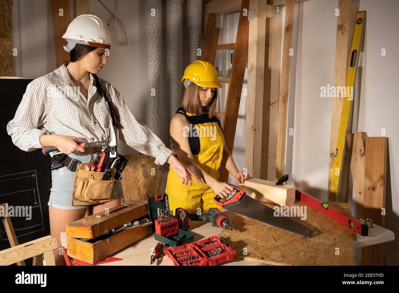 Young adult teens dressed with builder work clothes and personal ...
