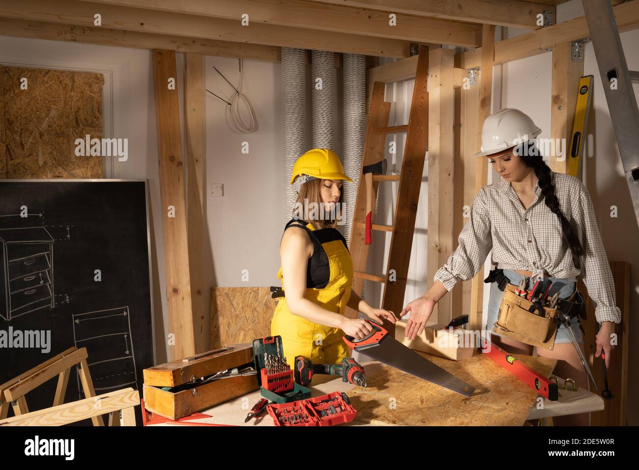Young adult teens dressed with builder work clothes and personal ...