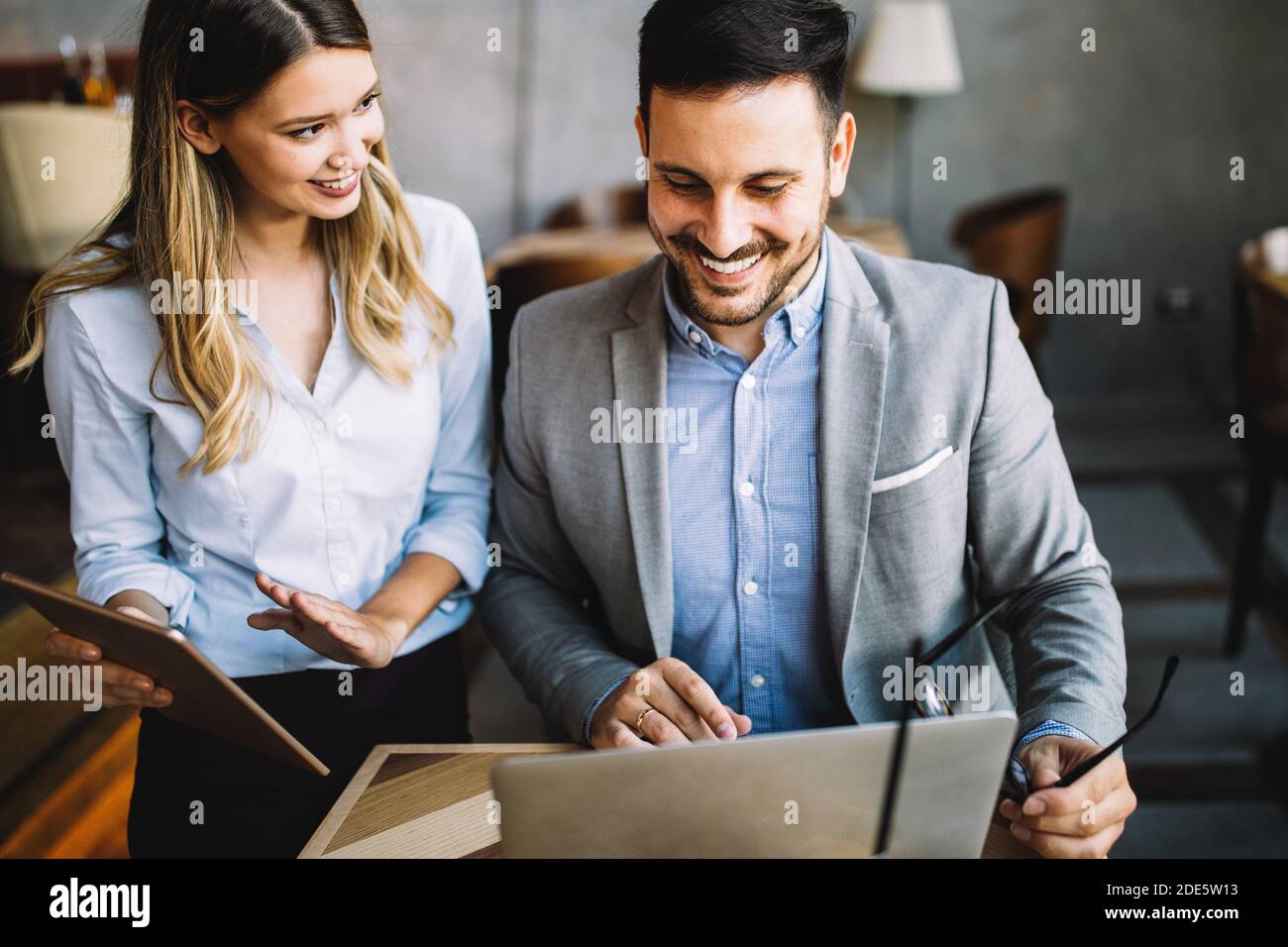 Programmers working in a software developing company office Stock Photo ...
