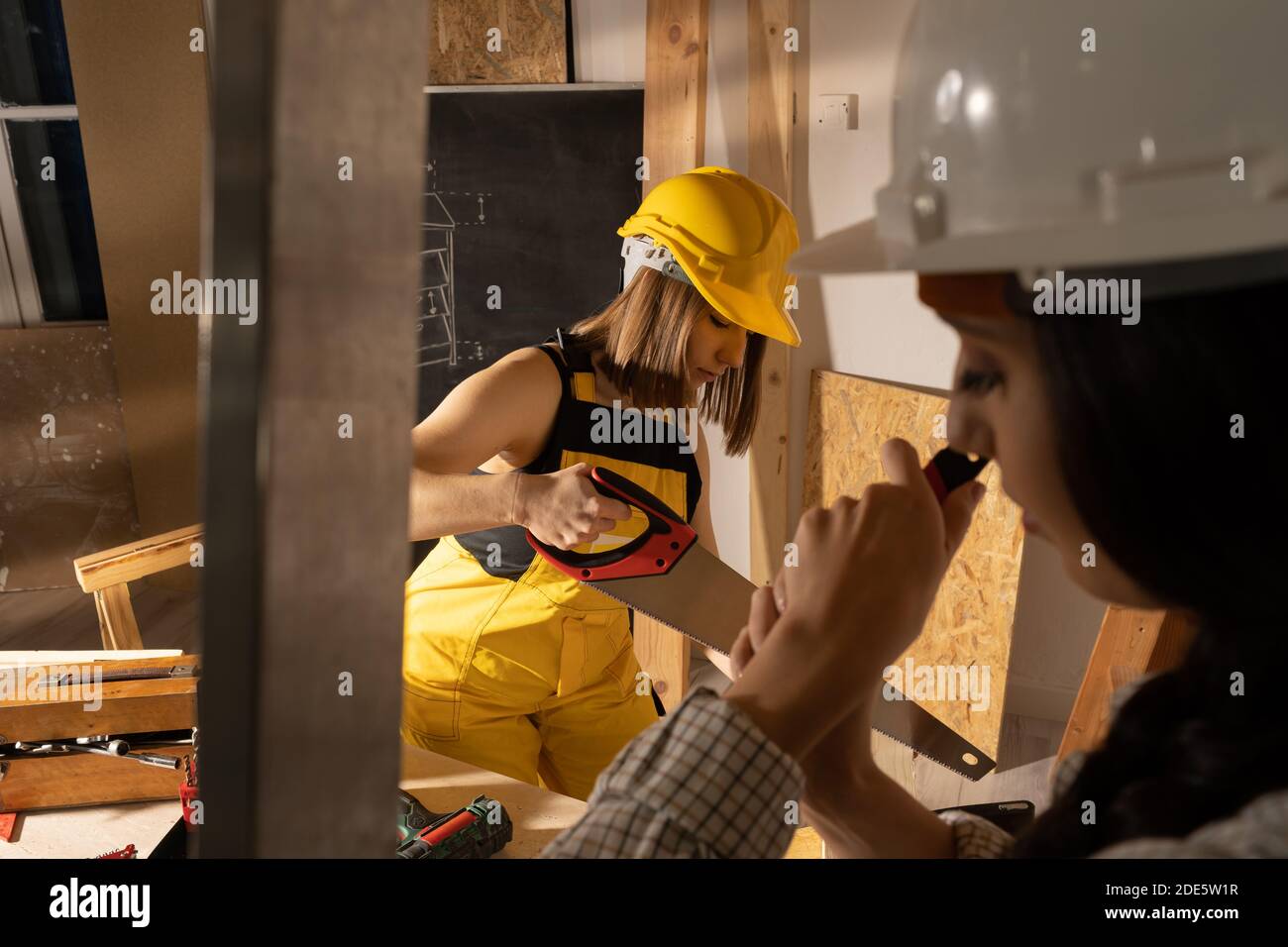Young adult teens dressed with builder work clothes and personal ...