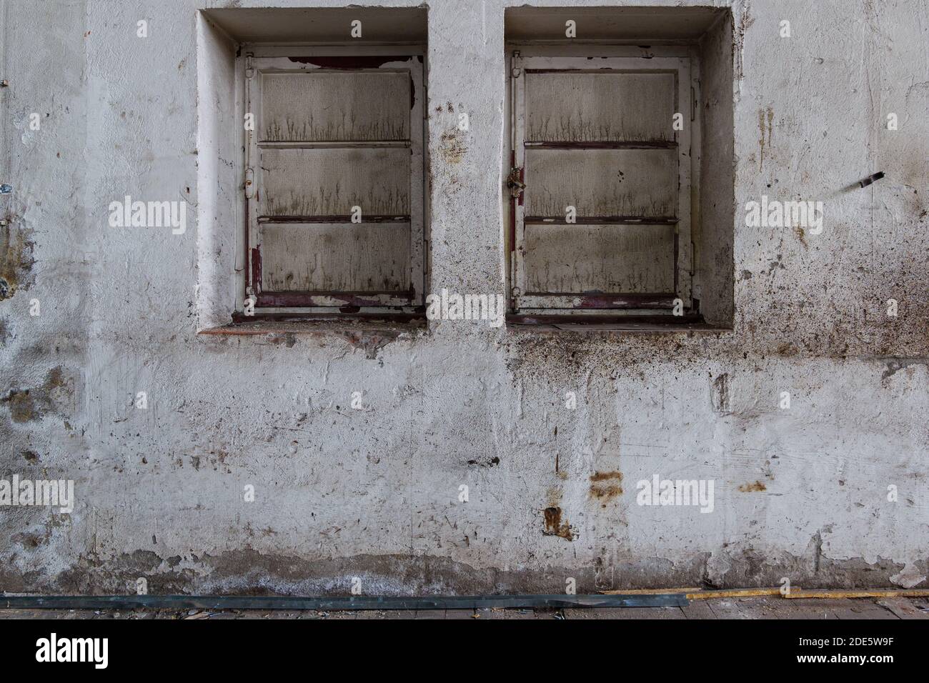 Front side interior view of old rough dirty white scratch concrete wall ...