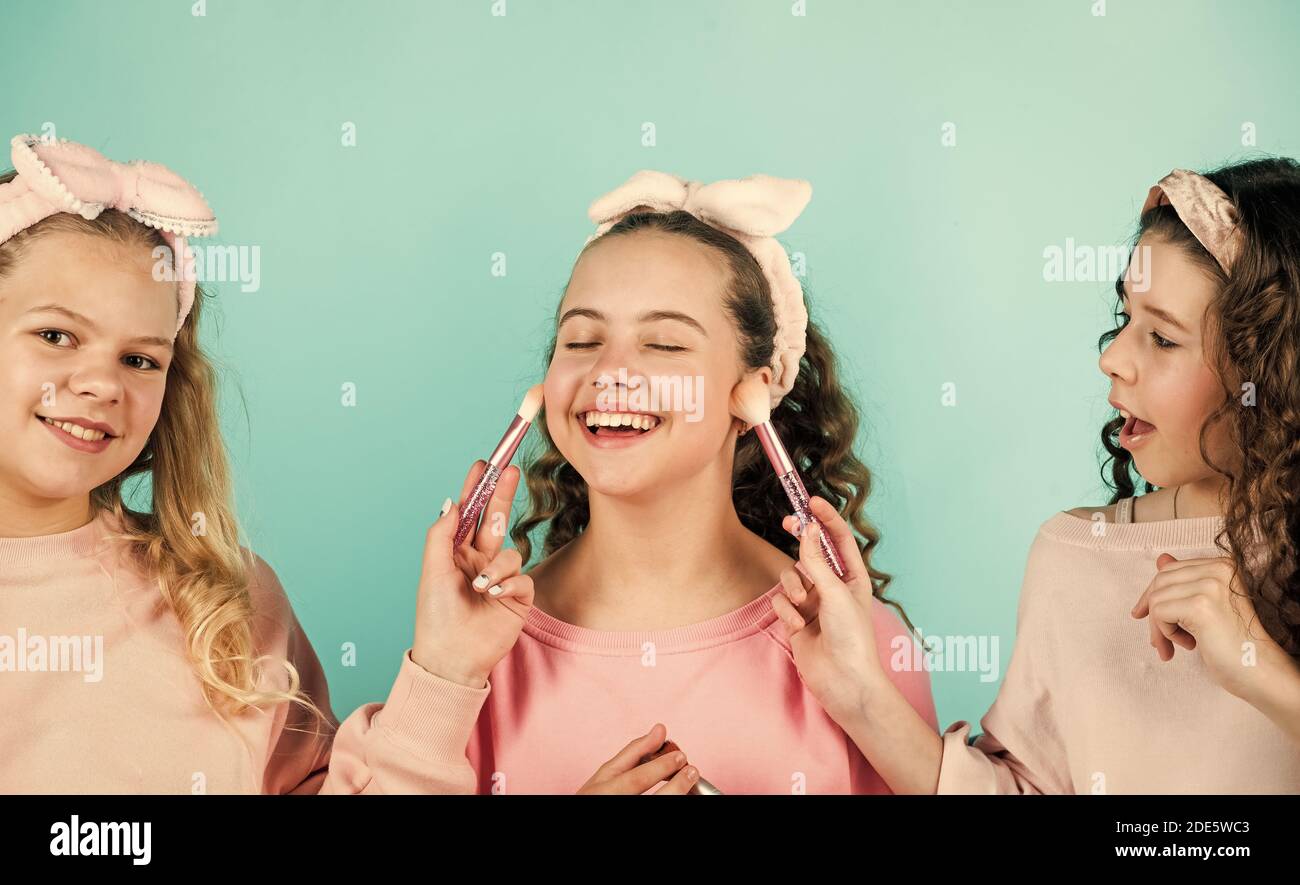 Happy girls doing makeup together. Sisterhood happiness. Skin care ...