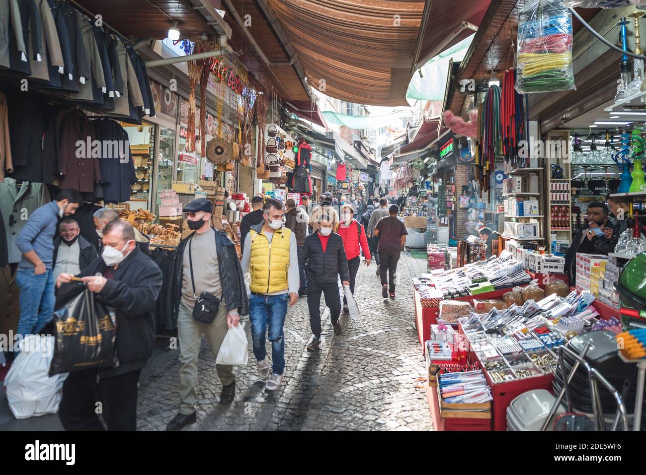 Unidentified Turkish people wearing protective face masks walking at ...
