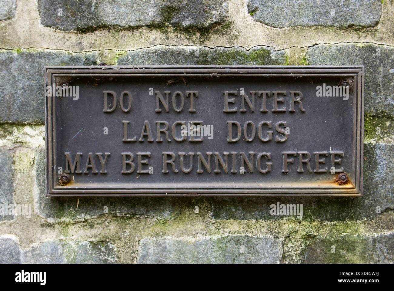 Do Not Enter Large Dogs Running Free sign on front wall of a large ...