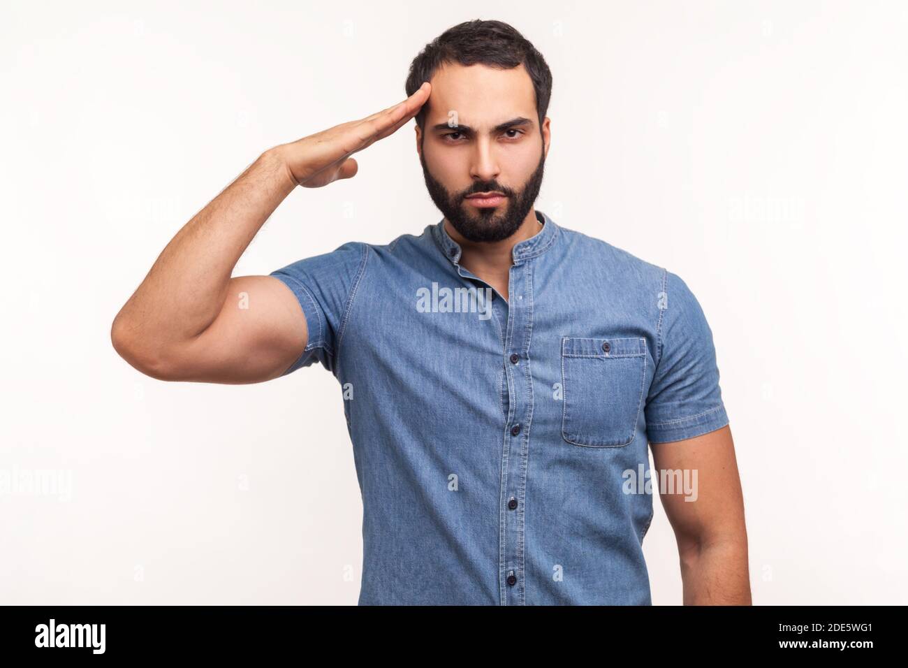 Yes sir! Subordinate disciplined man with beard saluting, holding hand ...