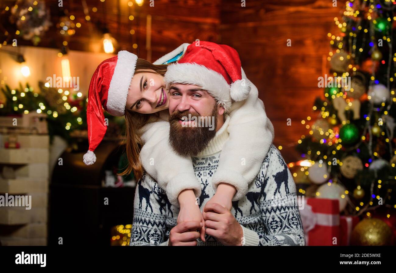 Festive spirit. Lovely married couple cuddle christmas tree background ...