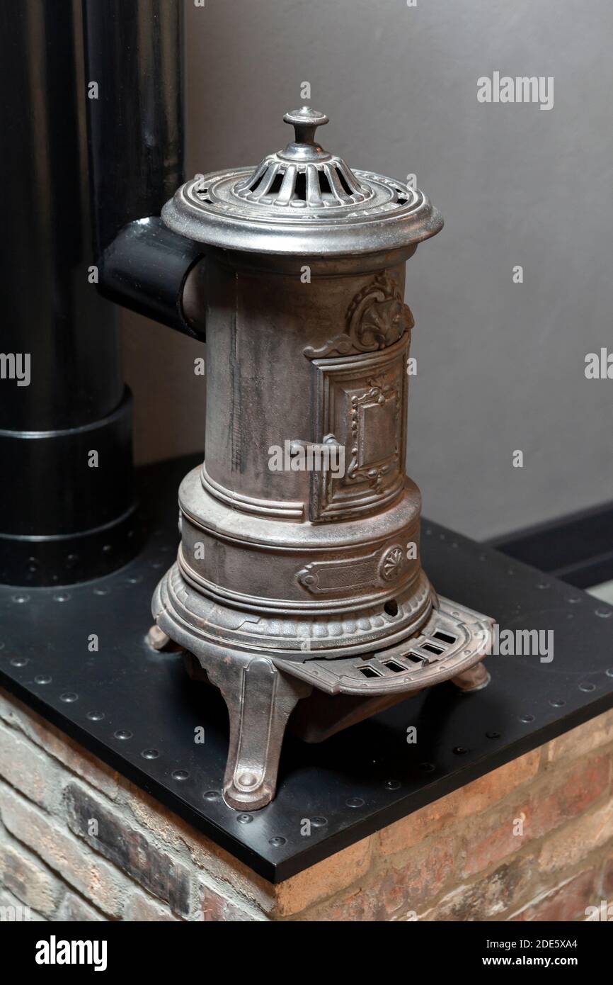 Small vintage stove as a part of home heating system Stock Photo - Alamy