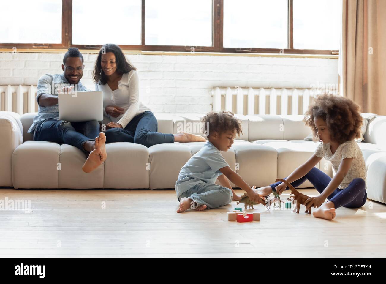 Happy loving black family of four gather together on weekend Stock ...