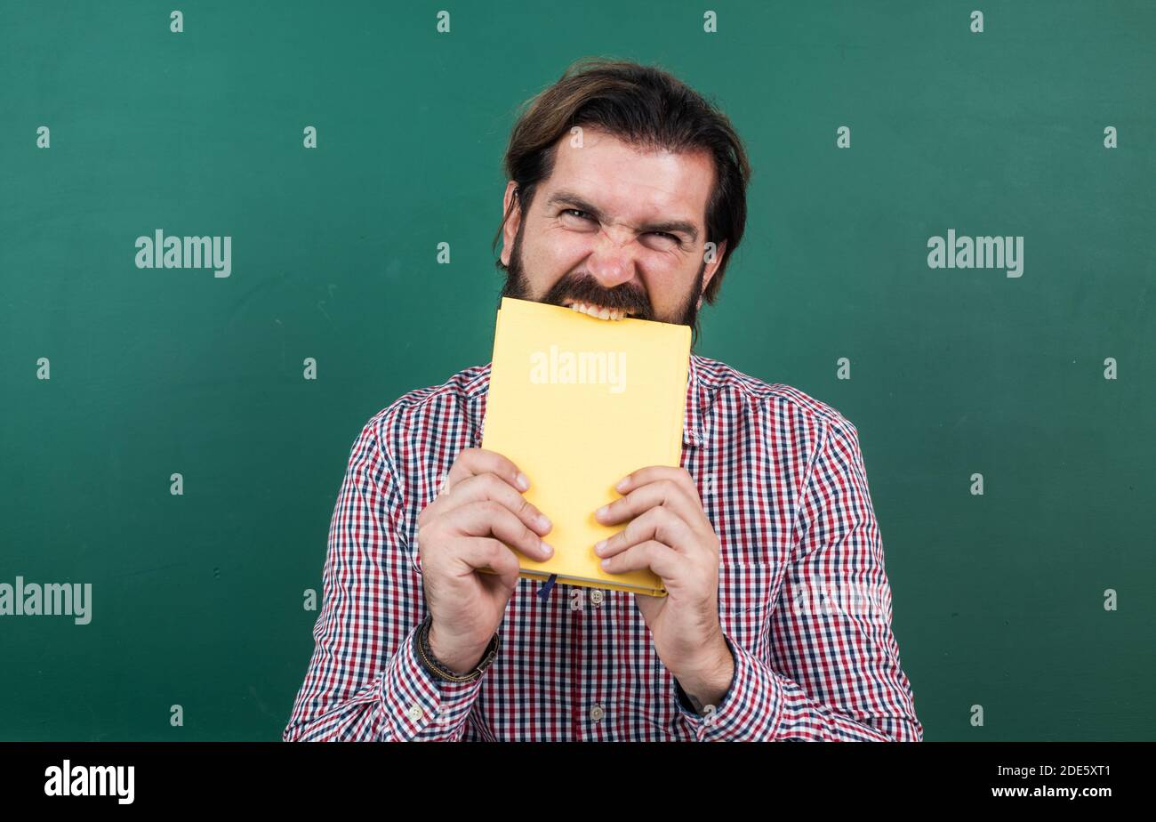 Angry business man biting hi-res stock photography and images - Alamy