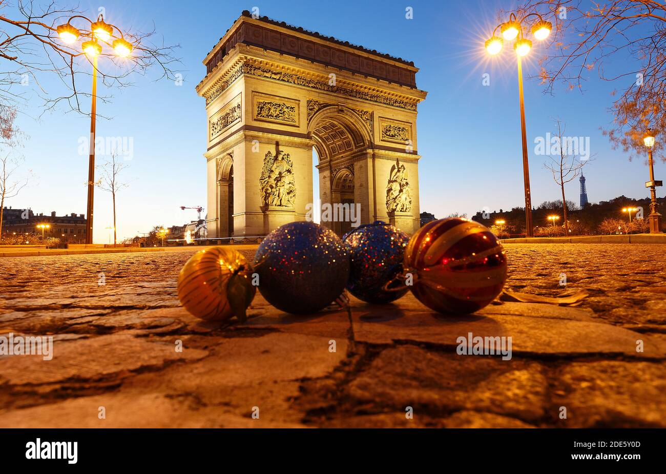 The famous Triumphal Arch at night and Christmas baubles. Paris. France ...
