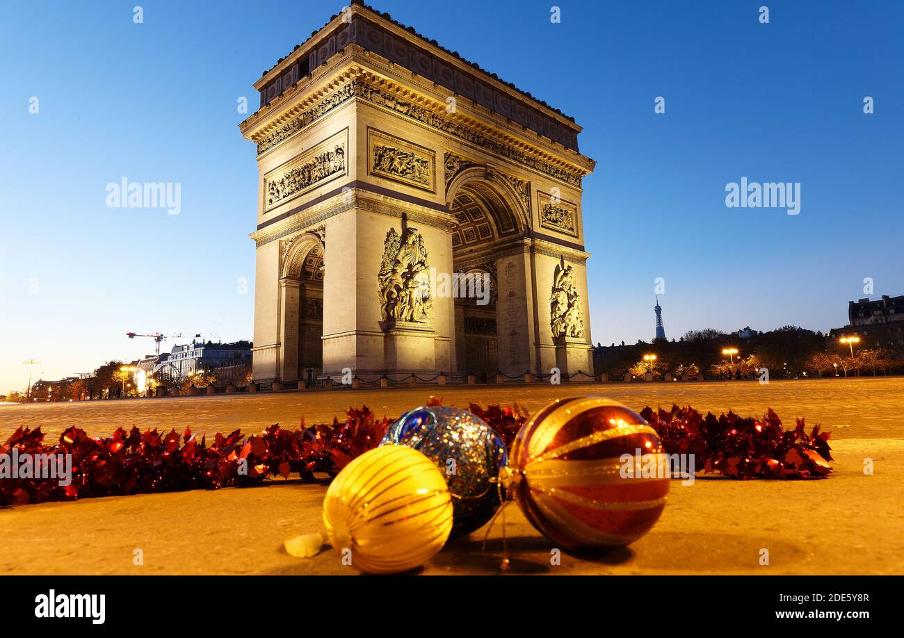 The famous Triumphal Arch at night and Christmas baubles. Paris. France ...