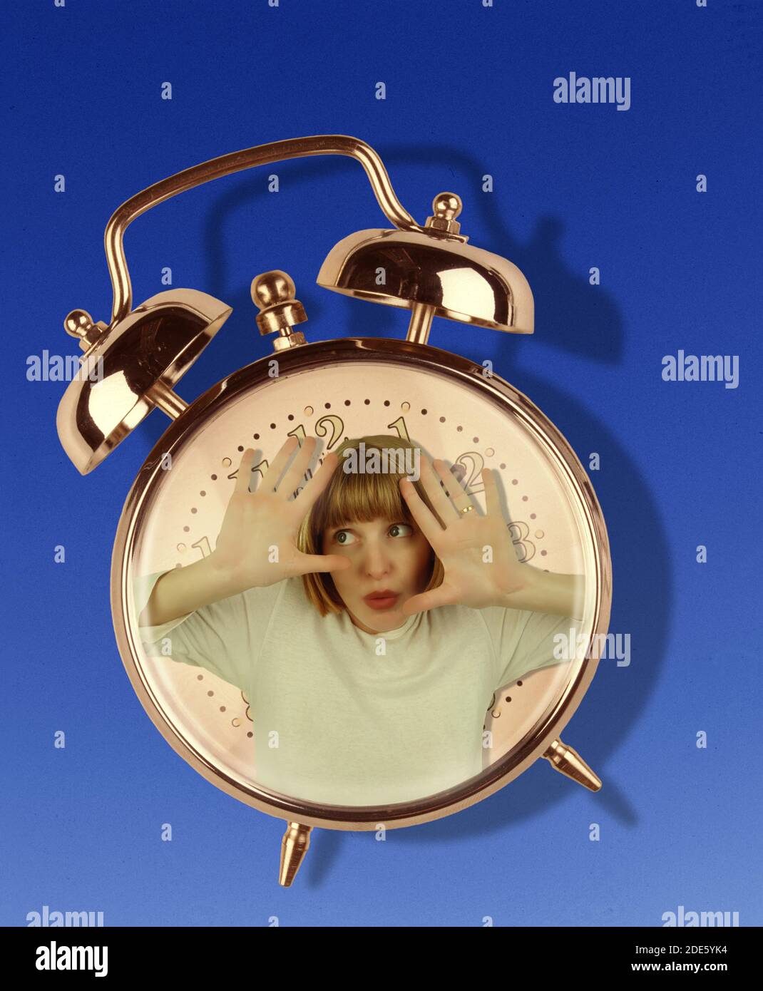 Frightened Woman inside Alarm Clock, Symbolic Image Stock Photo - Alamy
